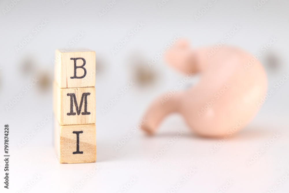 BMI letters Concept of Body mass index with human stomach on white ...