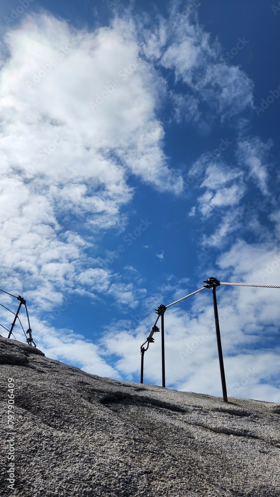 mountain path with metal railings. dangerous climb to the mountains ...
