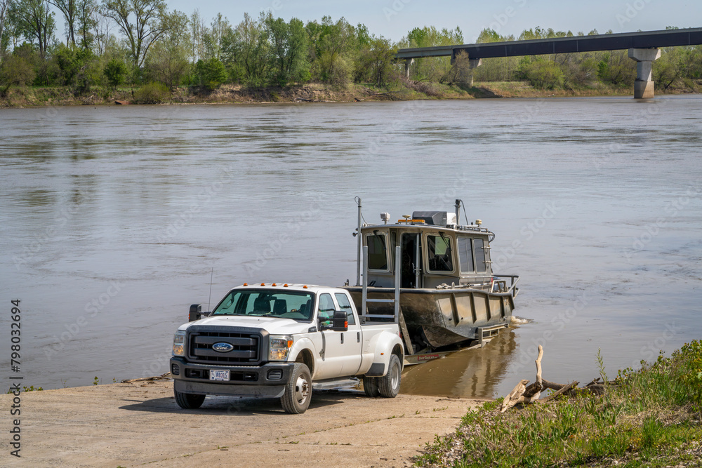Waverly, MO, USA - April 22, 2024: Launching a working boat by Munson ...