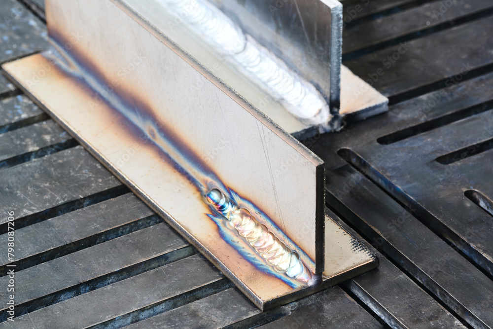 Welding steel beams completed in process shielded metal arc welding ...