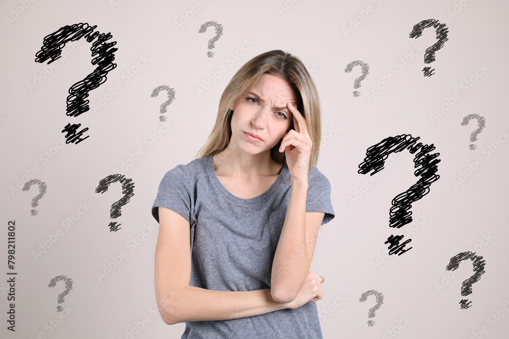 Amnesia Confused Young Woman And Question Marks On Light Background