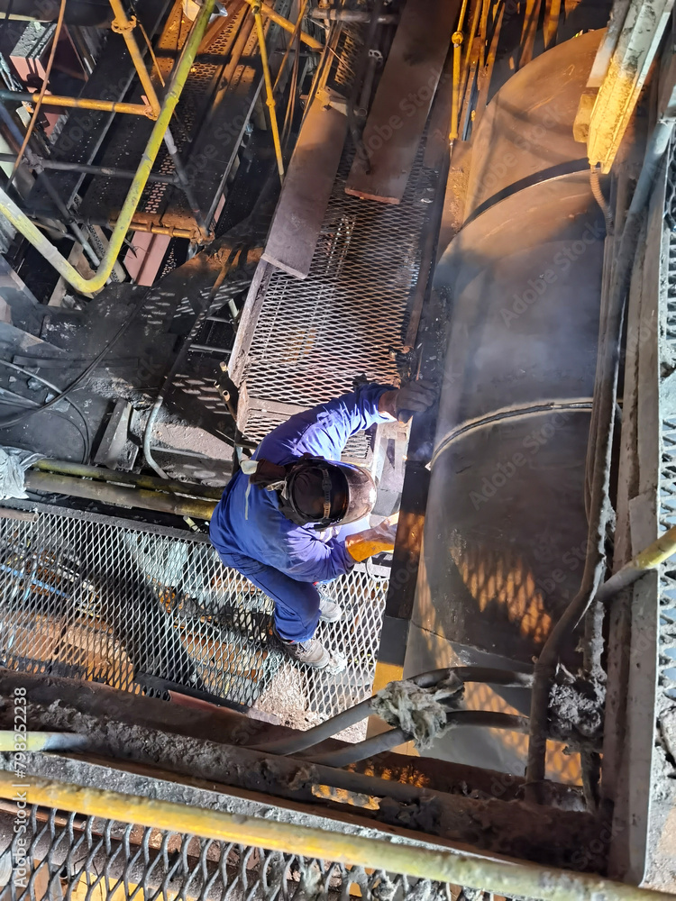 Industrial welder welding fabricated construction in factory Welding ...