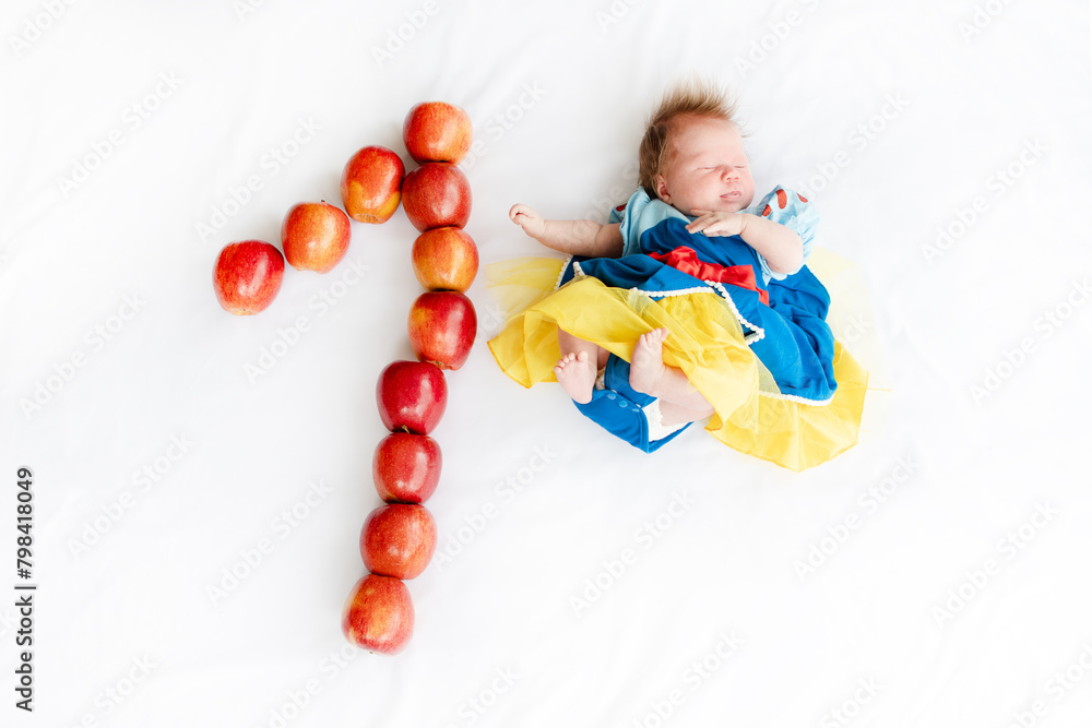 Flat lay picture of a 1 month baby with number made apples. Newborn ...