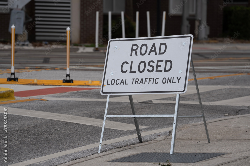 white road closed local traffic only sign in a downtown city Stock ...
