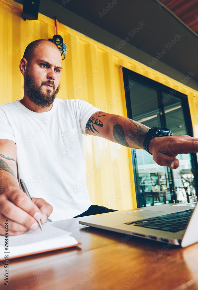 Clever caucasian male student copying information from web page to ...