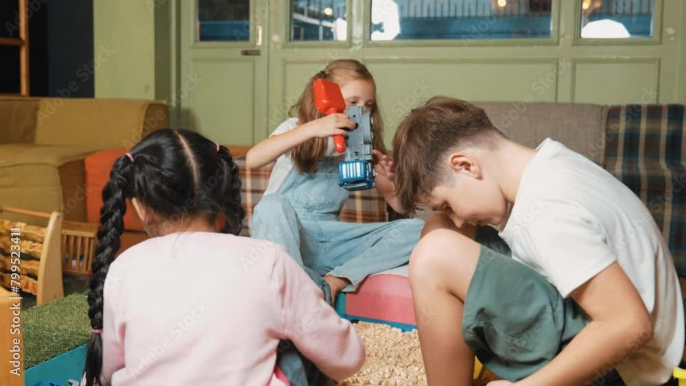 Vidéo Stock Diverse smart students play sandbox at play room ...