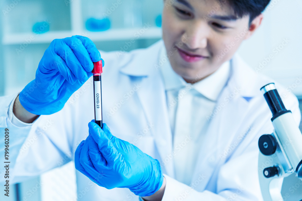 Close up Scientist man hands holding sample blood test tube science ...