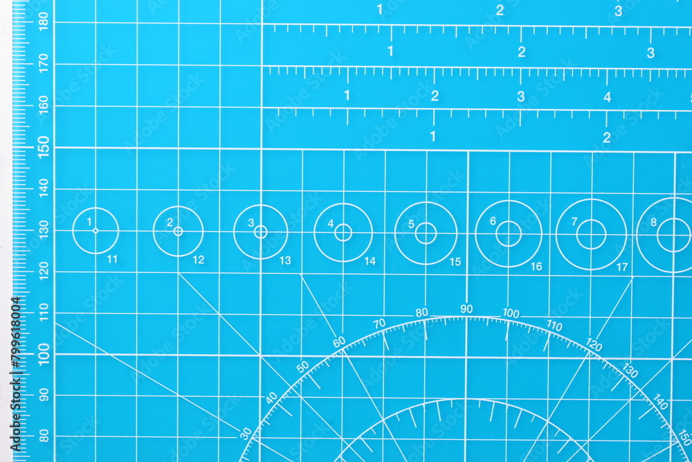 blue cutting mat board on white background with line and scale measure ...