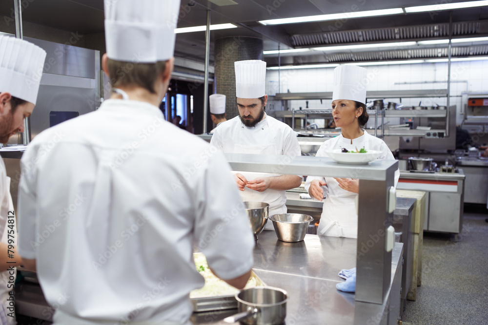 Chef, kitchen and hospitality with working and food prep for a ...