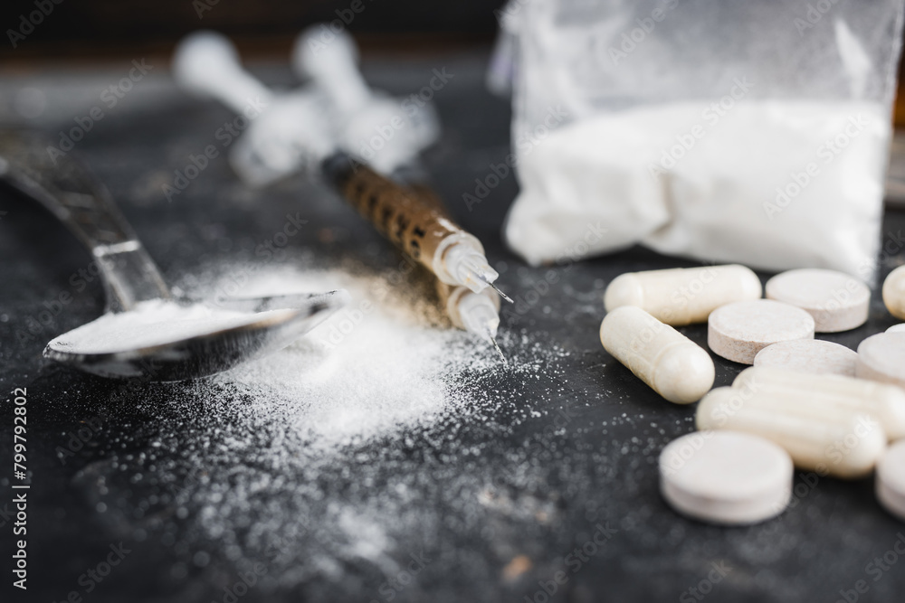 Narcotic substances in spoon, dope powder in transparent plastic bag ...