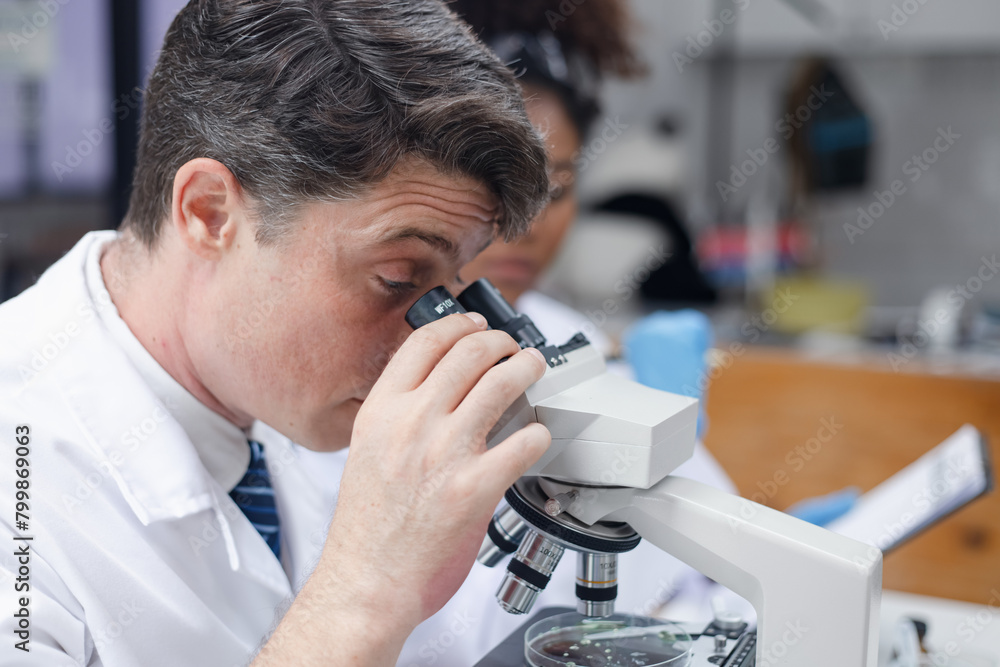 Medical science and microscope in laboratory for research concept. Two ...