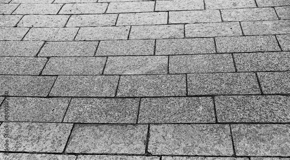 City road pavement made of bricks and stones, road texture in detail ...