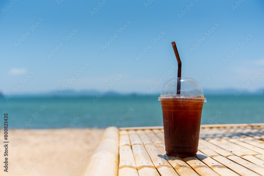 Ice black coffee and sea beach background, iced coffee americano in ...