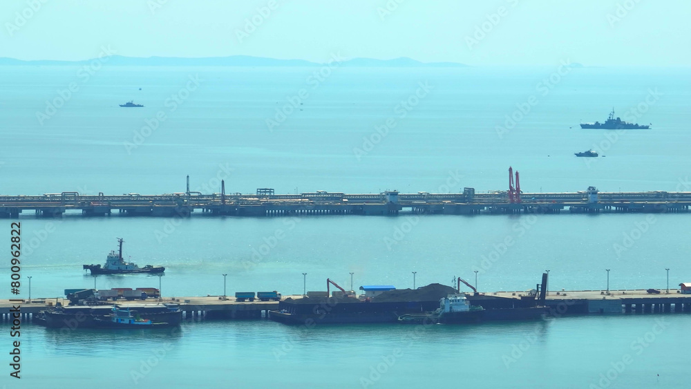 This port is like a helpful ocean arm, welcoming ships with open "arms ...