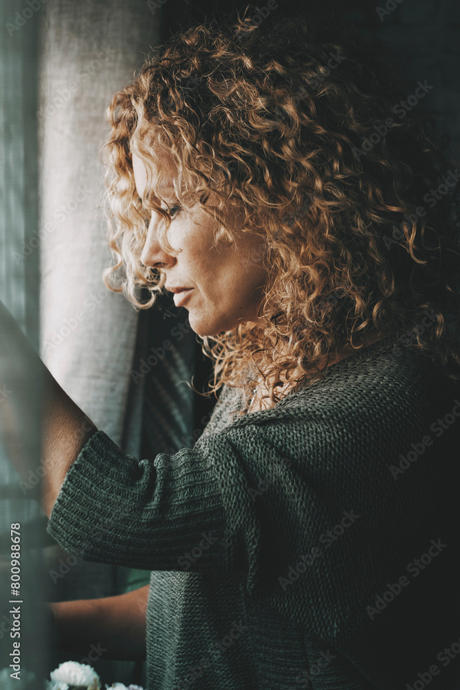 Sadness worried woman inside home near the window. Bad unhappy day ...