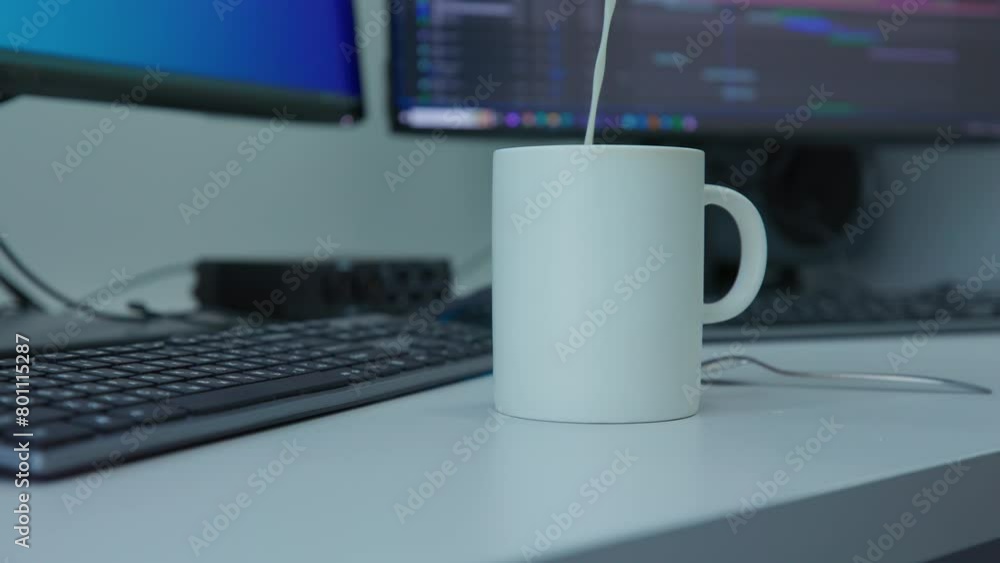 The process of adding milk to coffee cup and a man's hand starting to ...