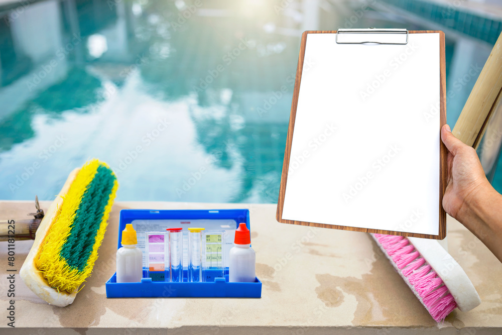 Blank report paper sheet on wooden clipboard and water testing test kit ...
