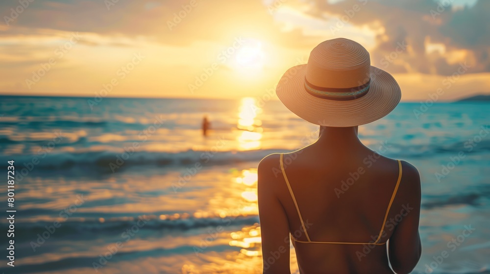 Person applying sunscreen on their back at the beach concept of skin ...