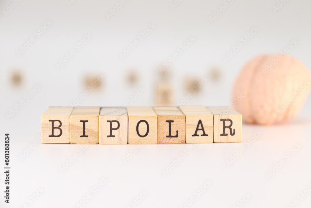 Bipolar word written on wooden cubes isolated on white background with ...
