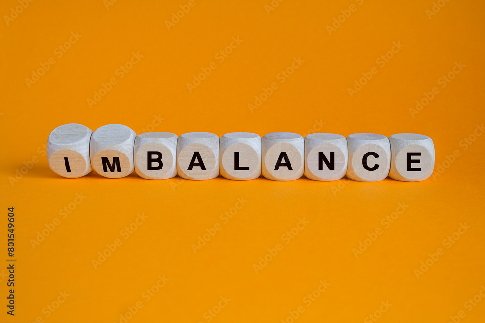Balance or imbalance symbol. Turned wooden cubes and changes the word ...