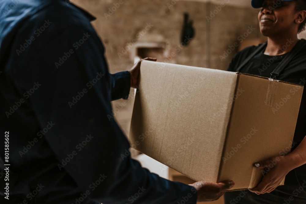 Delivery man handing box to customer Stock Photo | Adobe Stock