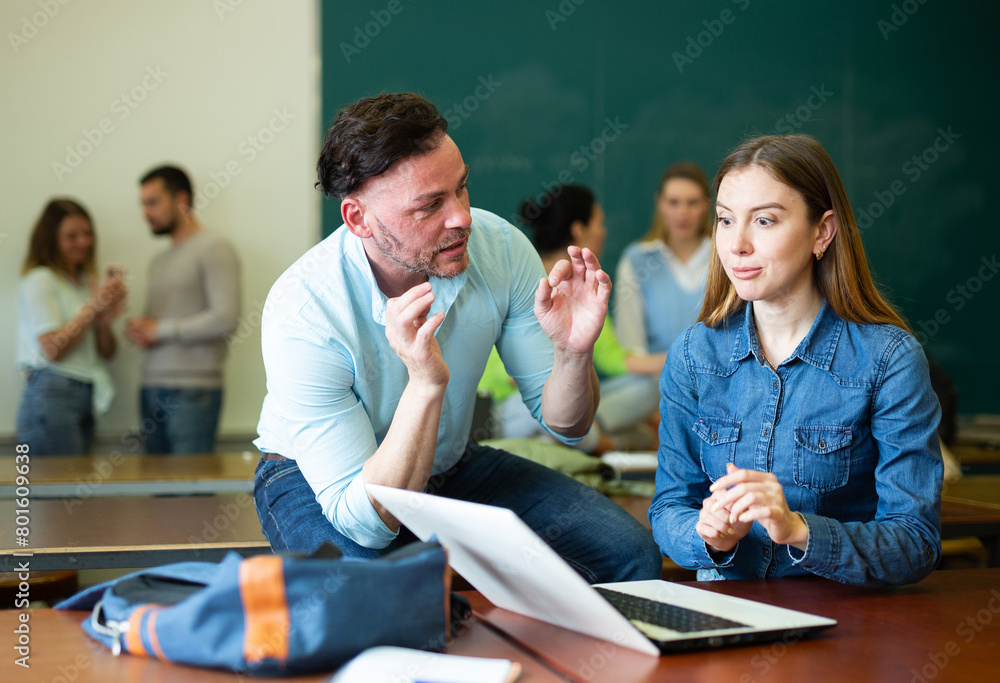 Dissatisfied female student showing stop gesture to annoying male ...