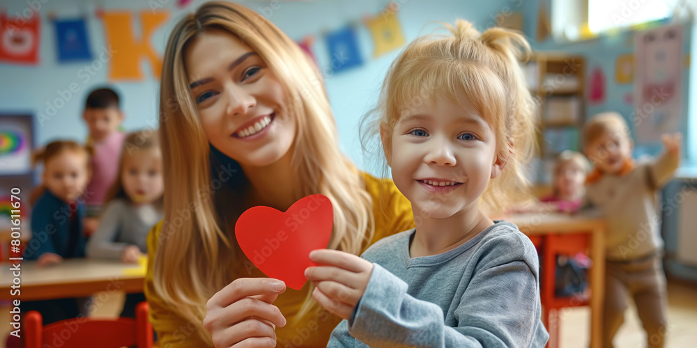 Cute young child giving a heart-shape card to their kindergarten or ...