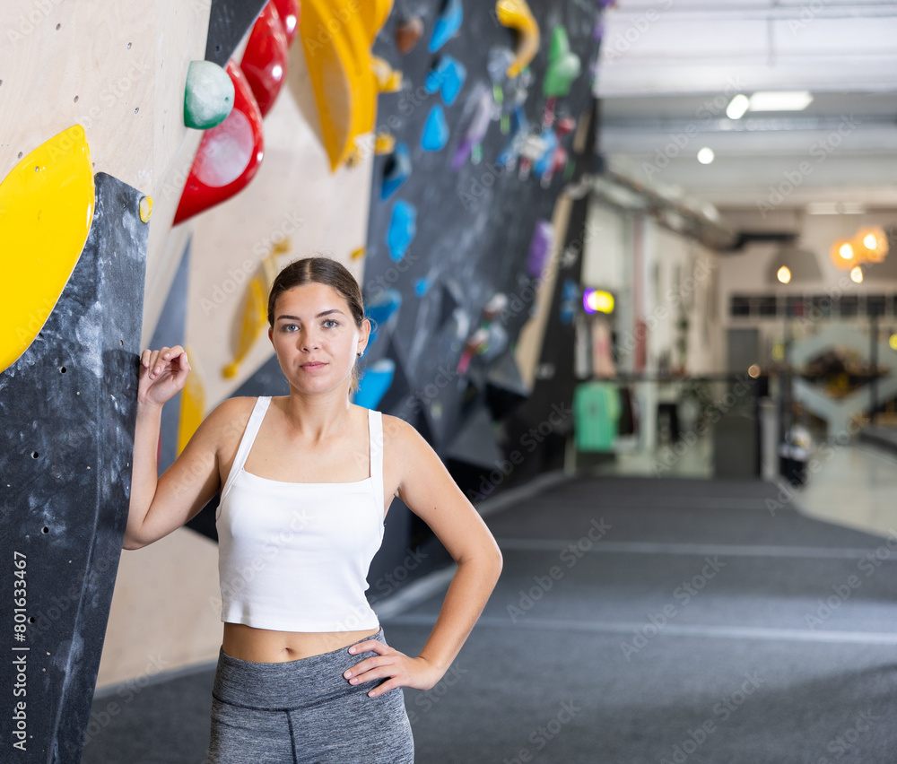 Positive motivated young girl in casual sportswear standing in modern ...