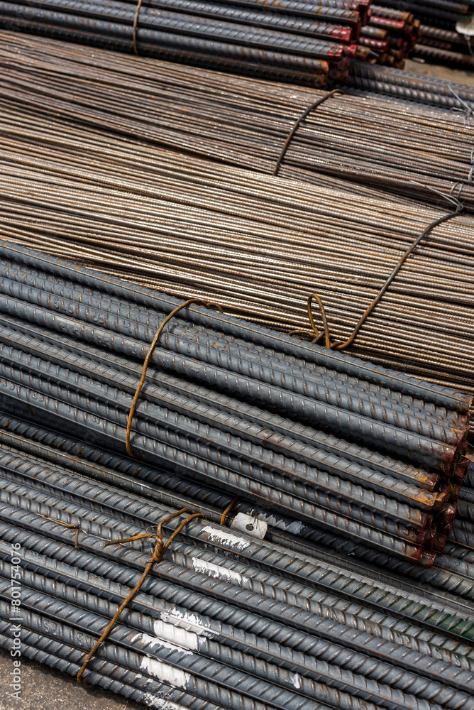 Detailed image showing a close-up of rusted steel reinforcement bars ...