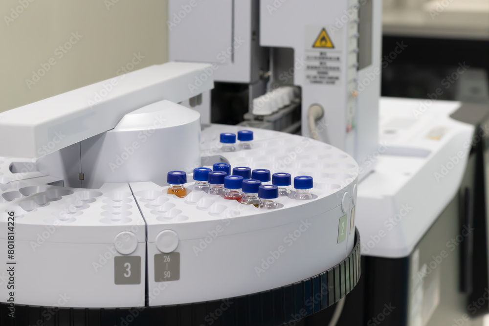 vial on autosampler of gas chromatography instrument in chemistry, gc ...