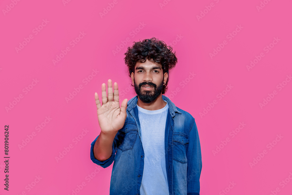 Serious young indian man showing stop hand objection no gesture sign ...