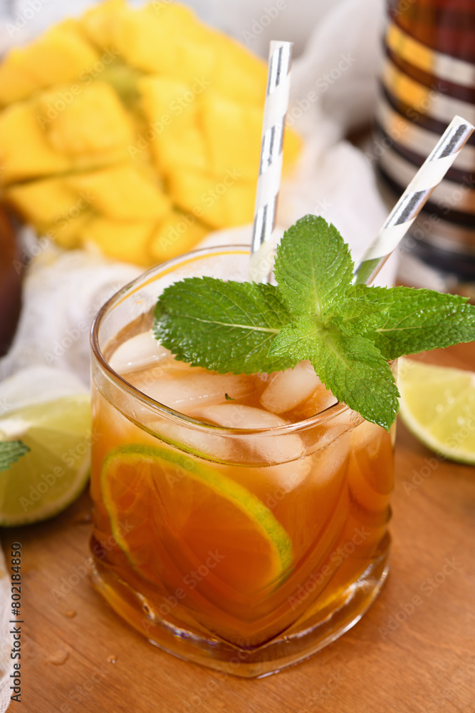 Mango iced tea with lime and mint has the perfect ratio of juice, tea ...