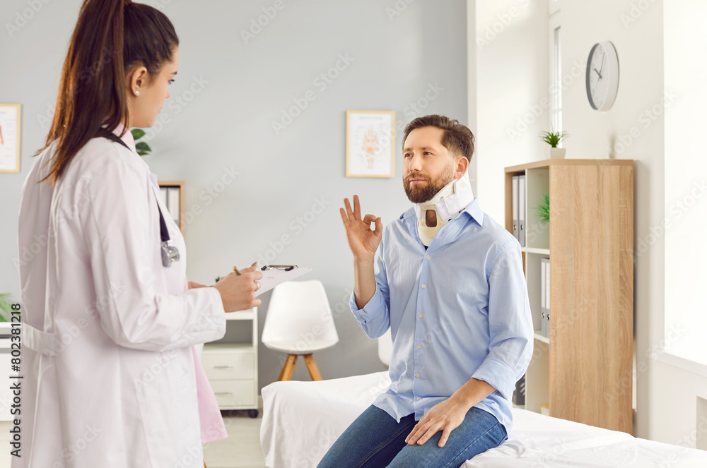 Doctor and neck brace man feeling good, orthopedic cervical collar ...