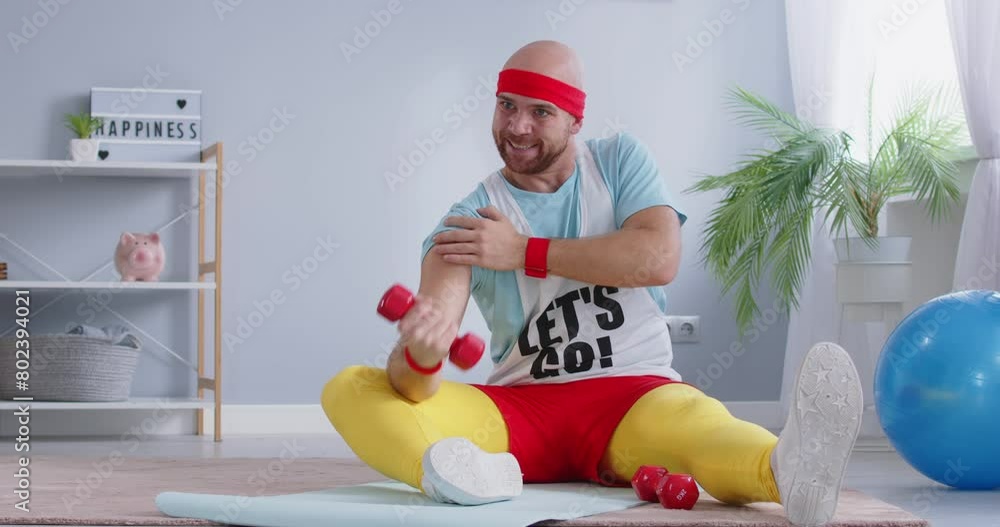 Funny sports man sits and flexes his biceps dedication to healthy ...