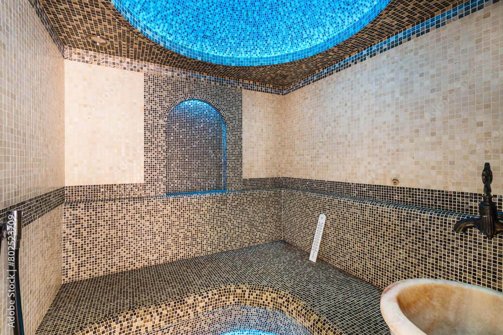 Traditional Turkish bath hamam, decorated in oriental style. Sink with ...