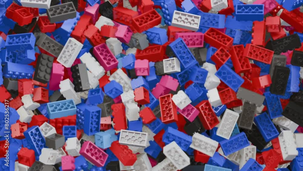 Pile of colorful children building brick blocks moving around in a ...