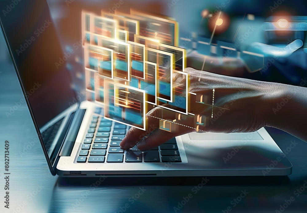 Close-up image of hands typing on a laptop keyboard, with glowing ...