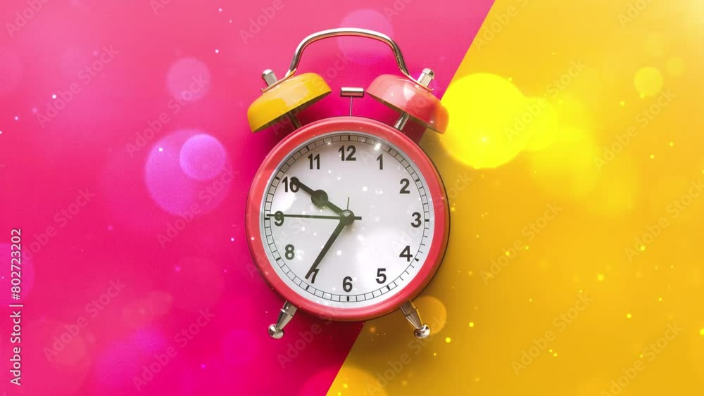 stylized alarm clock on a yellow and pink background. seamless looping ...