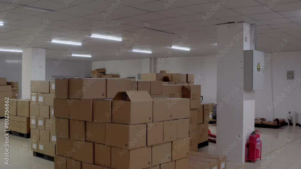 Clean storage facility filled with hundreds of packaged goods. Boxes ...