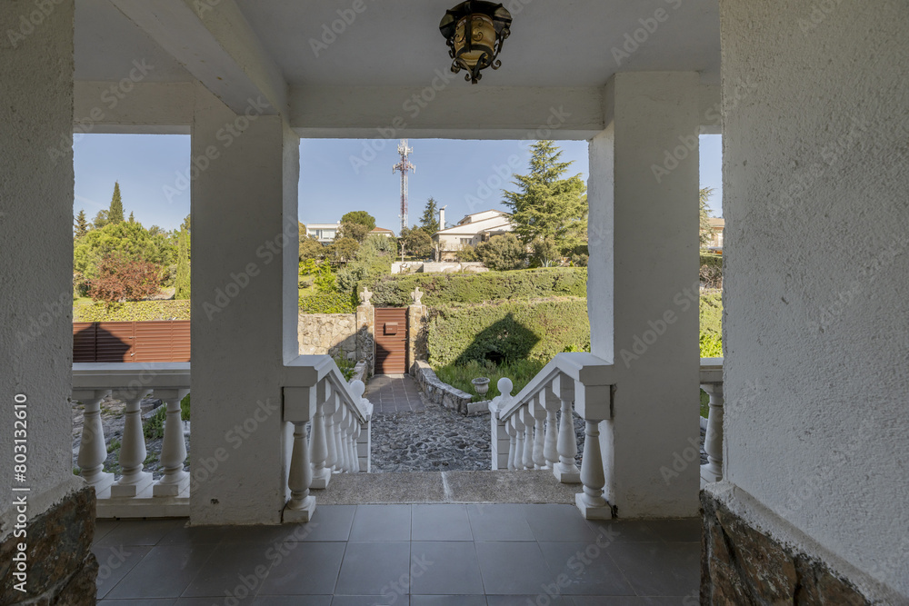 Exterior stairs of a single-family home with white prefabricated ...