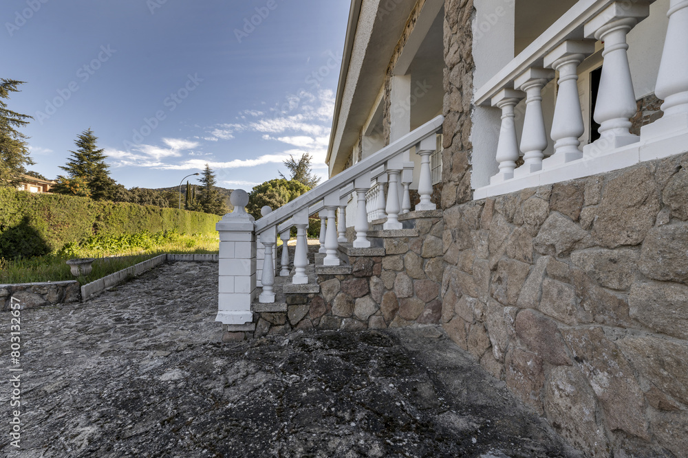 Exterior stairs of a single-family home with white prefabricated ...