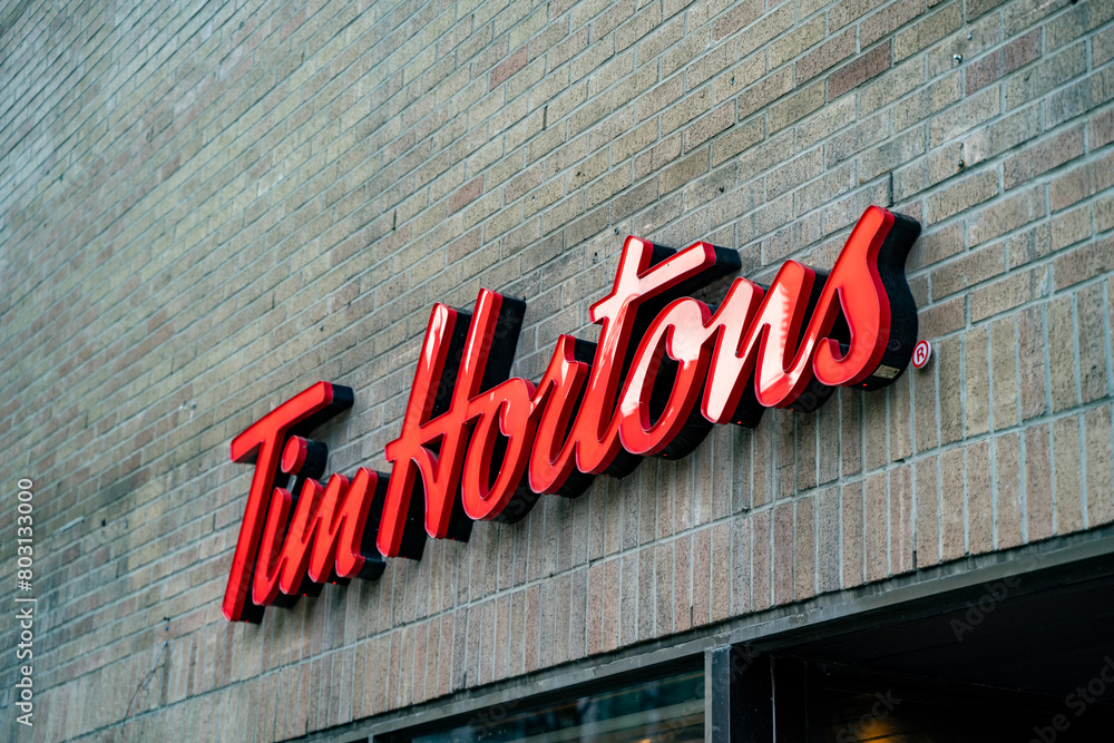 Tim Hortons logo sign. Tim Hortons Inc. is a multinational coffeehouse ...