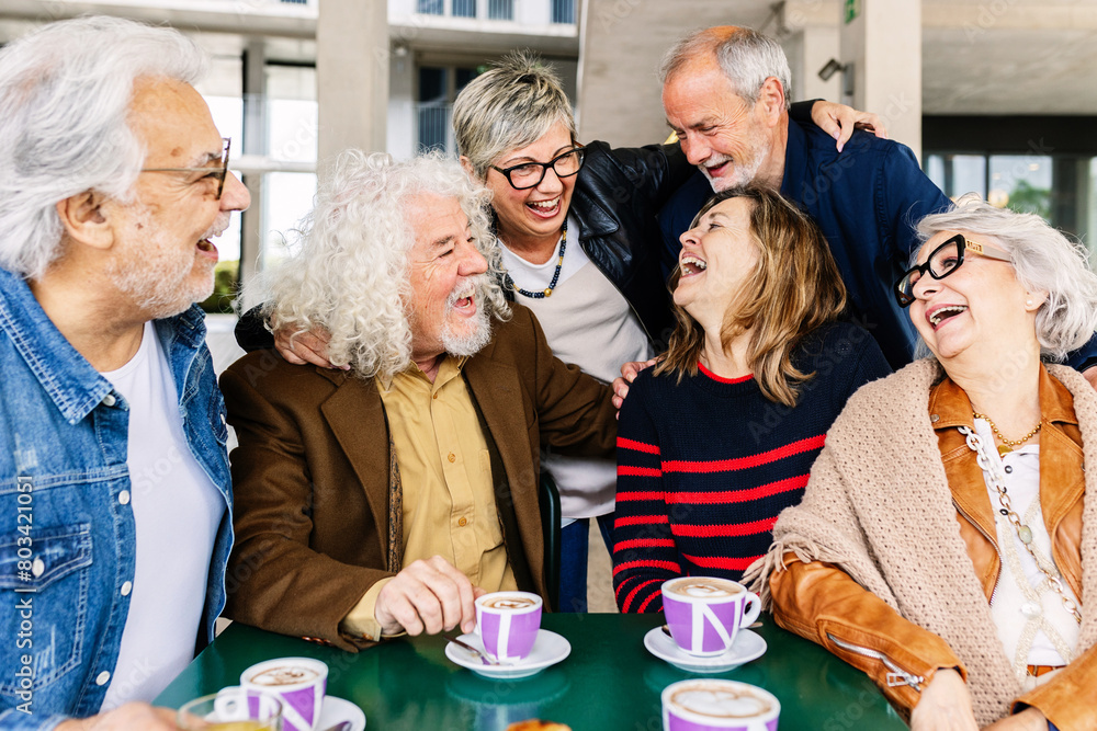 Joyful group of senior friends having fun drinking coffee at cafeteria ...