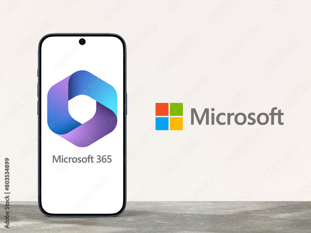Microsoft 365 Logo is displayed on a modern smartphone standing on a ...