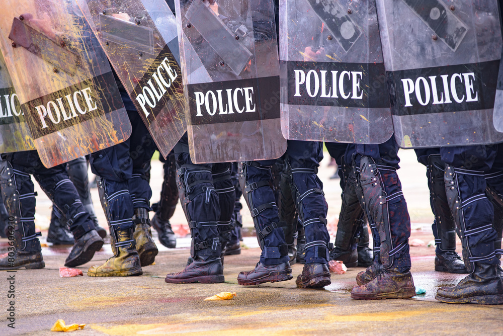 Riot police dispersed protesters and were pelted with paint. Stock ...