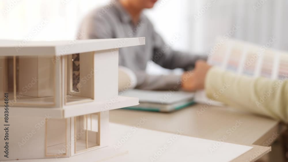 Slow motion home designer using architectural equipment draw a ...