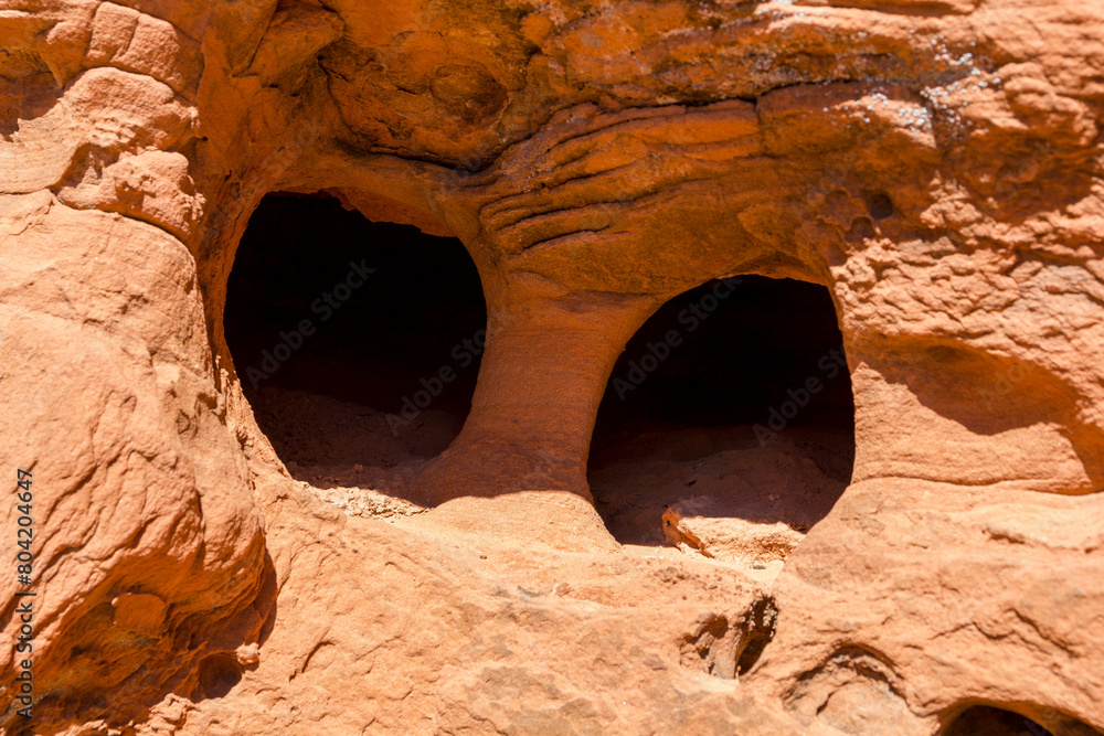 two unique holes look like cave entrance in the rock formations of the ...