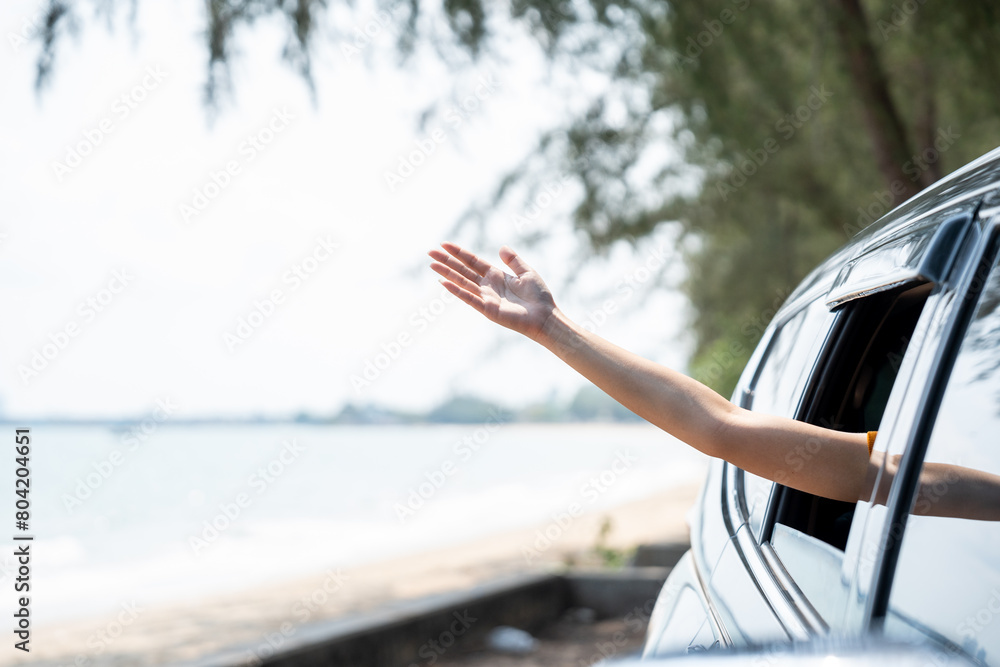 Young woman drove to the provinces sea sand beach. Parked on the side ...