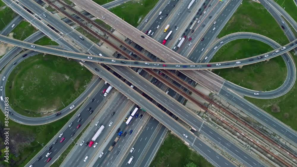 Sprawling highway networks alive with movement, cars navigate concrete ...