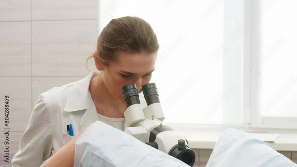 Gynecological office in a modern clinic. The gynecologist uses a ...